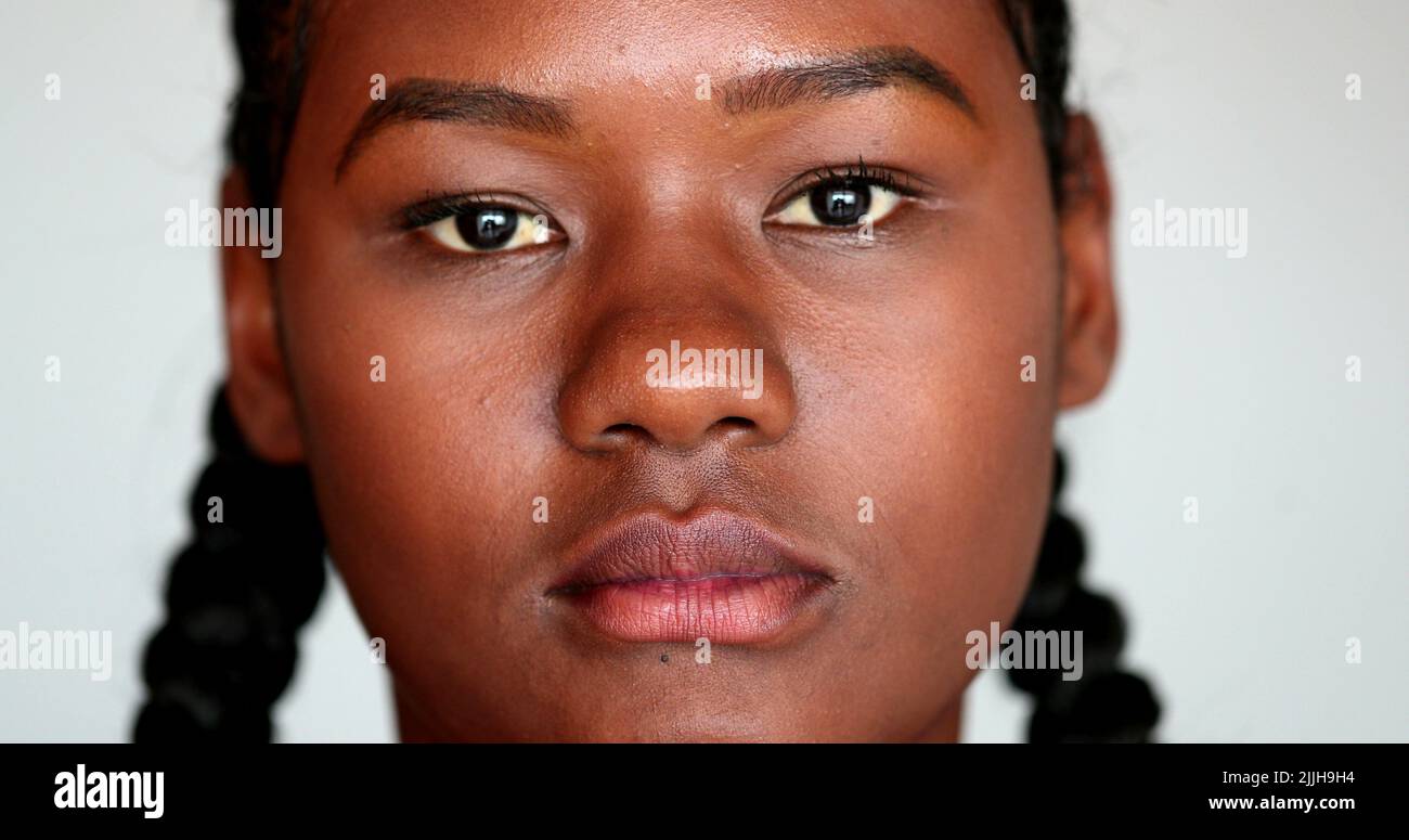 African young woman face portrait. Dramatic intense staring portrait ...