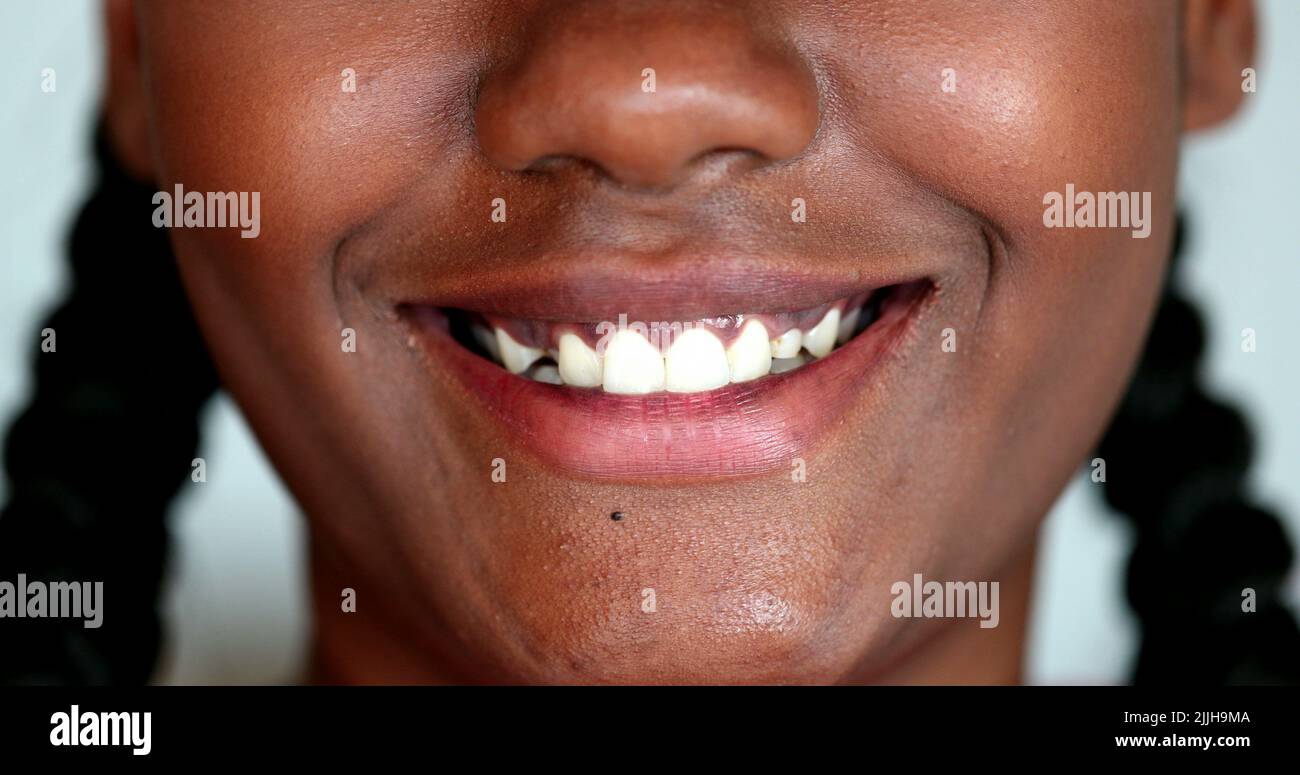 Black African woman lips smiling. macro close-up girl smile Stock Photo ...