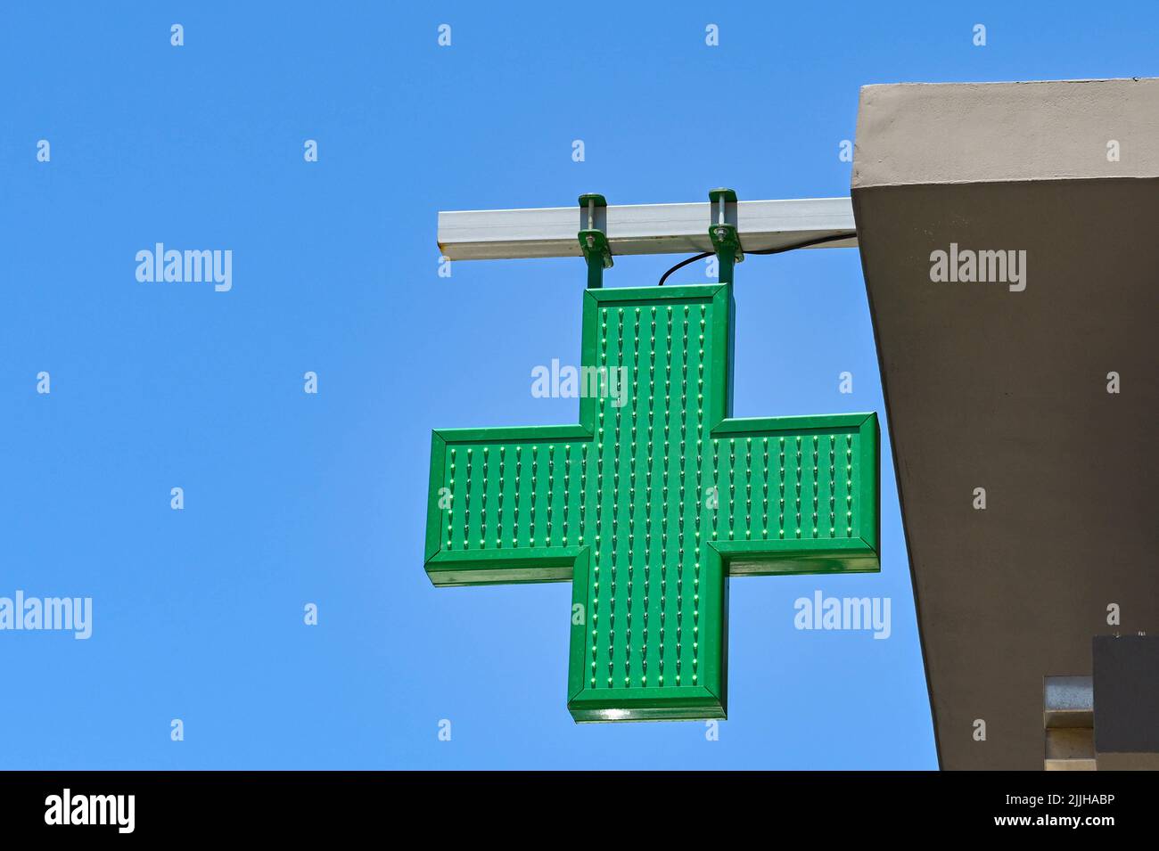 Unbranded sign for a pharmacy against a deep blue sky. No people Stock ...