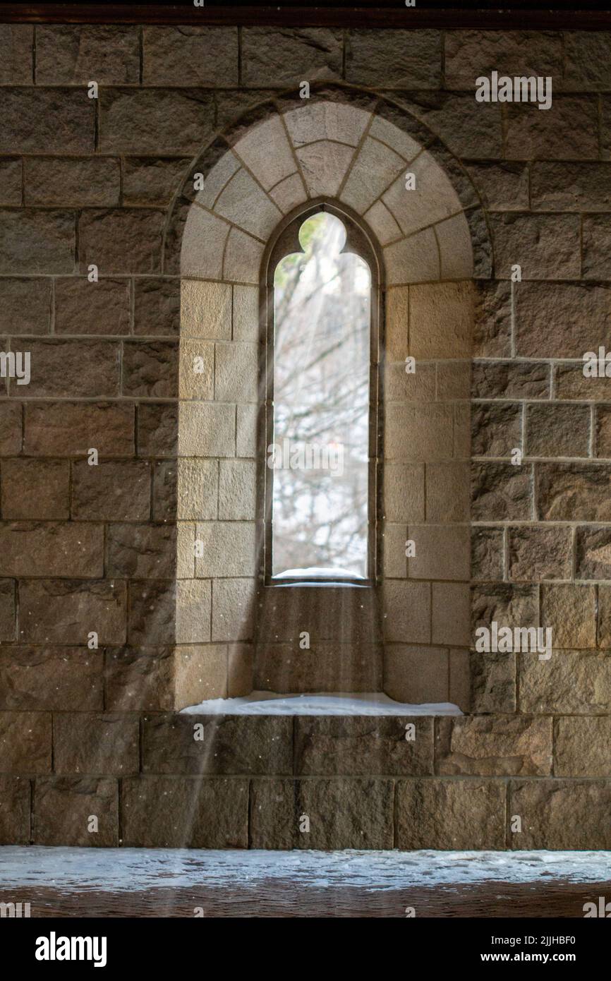Light streaming through medieval window in the Cloisters, New York ...