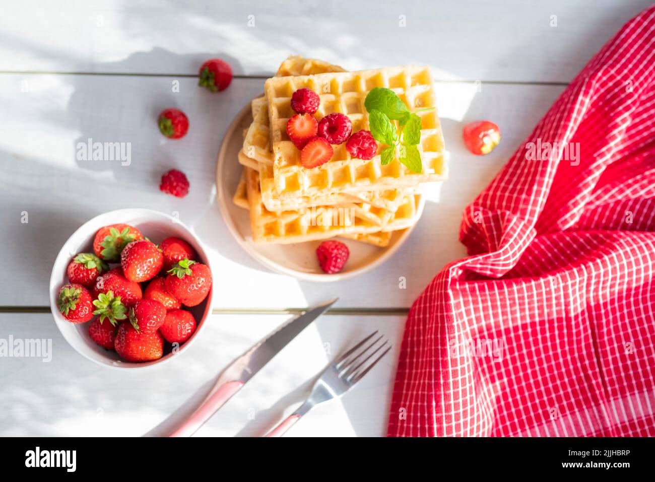 delicious Belgian waffles with strawberries and raspberries Stock Photo ...