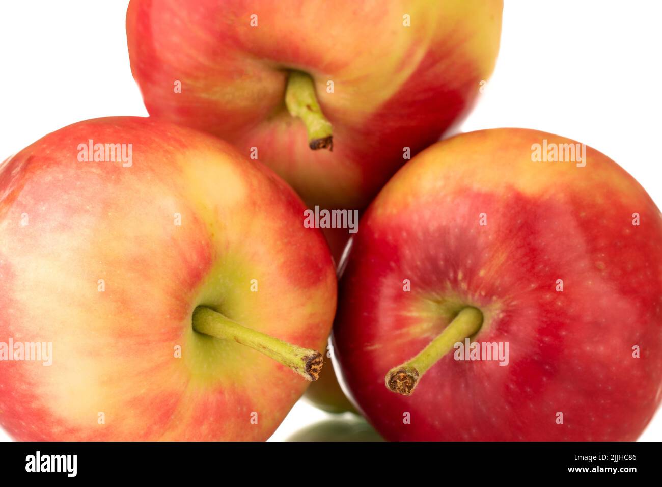 Three red sweet apples , close-up, on a white background Stock Photo ...