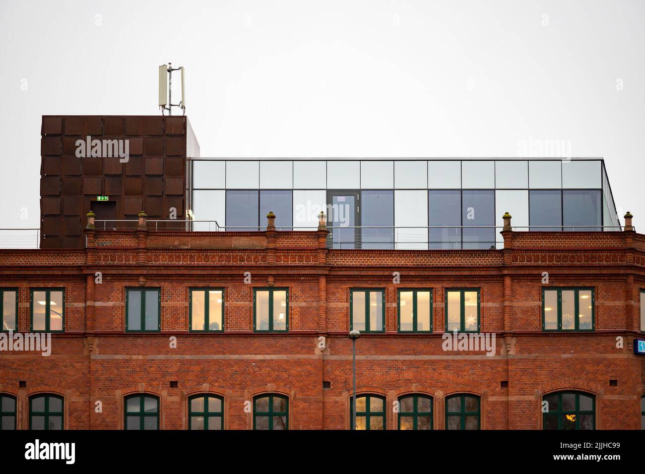 A red brick building covering a small block in Lund, Sweden Stock Photo ...