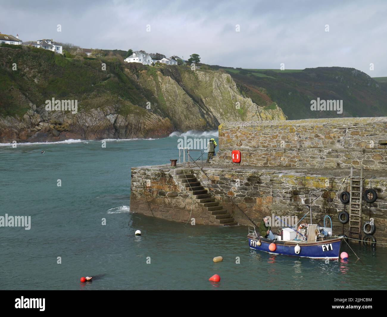 Fishermen on the Harbour Wall at Gorran Haven, Cornwall, UK Stock Photo ...