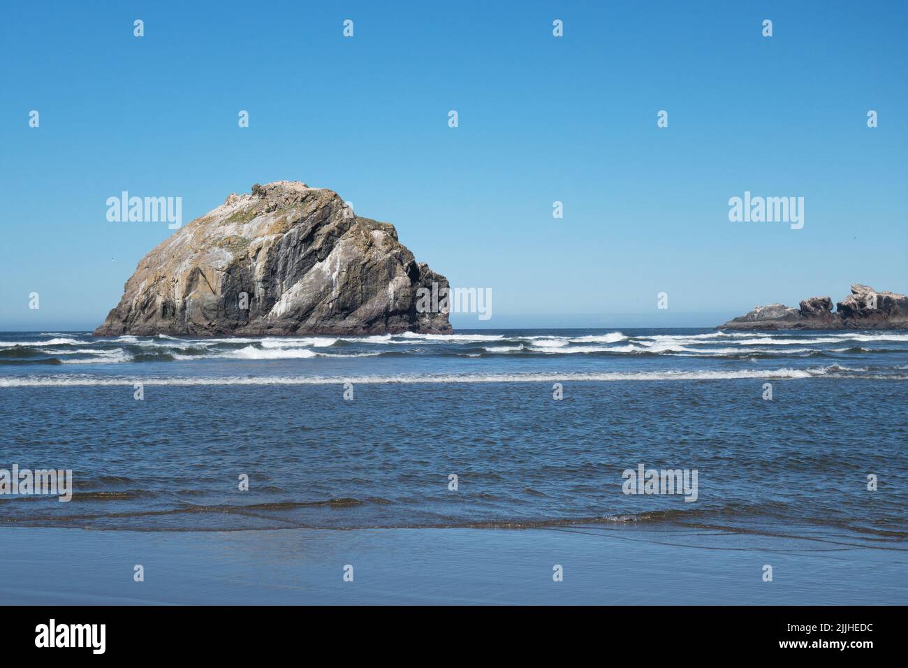 A large rock that looks like a woman's face, at Face Rock Beach in ...