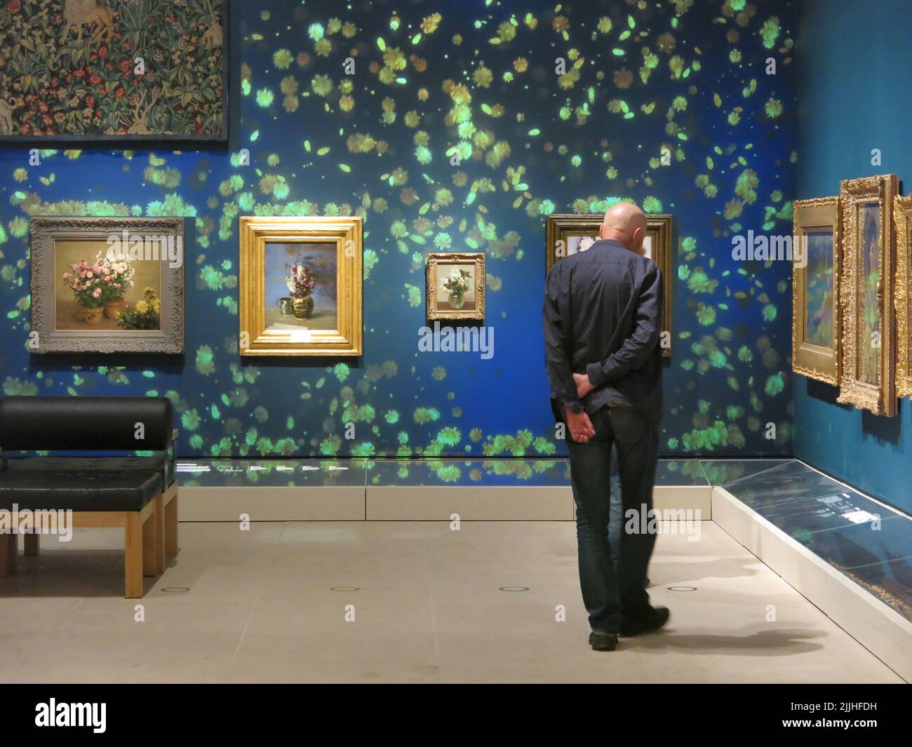 The Burrell Collection: a man looks at the flower paintings in one of ...