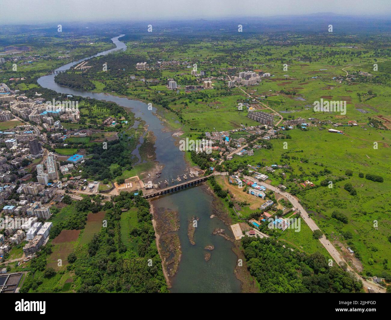 A bird's eye view of a river surrounded by green vegetation Stock Photo ...