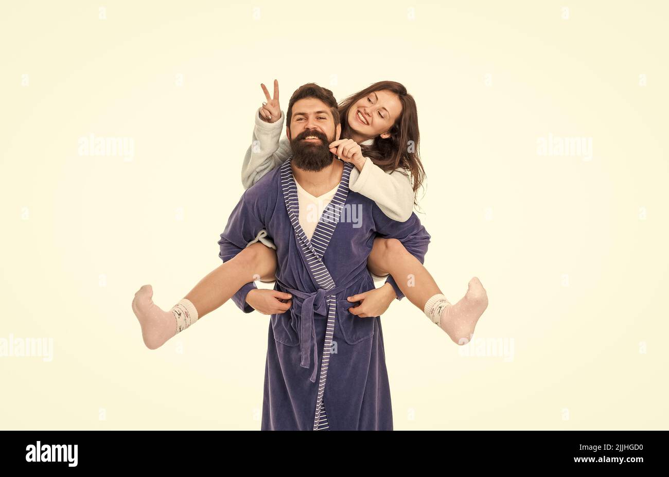 You win my love. Man give piggyback ride to woman showing V sign ...