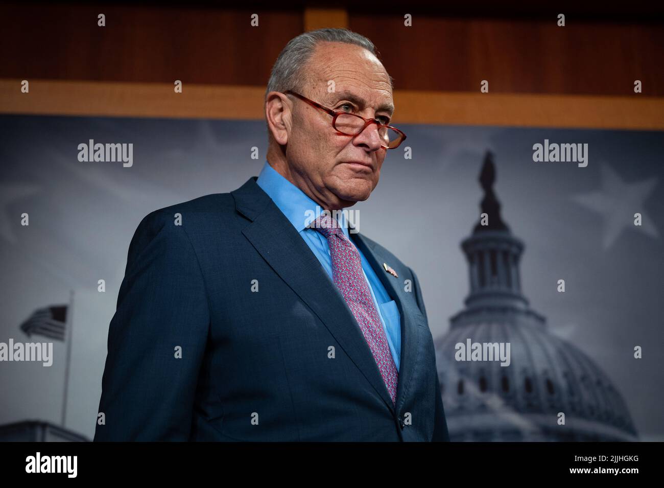 Senator Chuck Schumer (D-N.Y.), the Senate Majority Leader, listens to ...