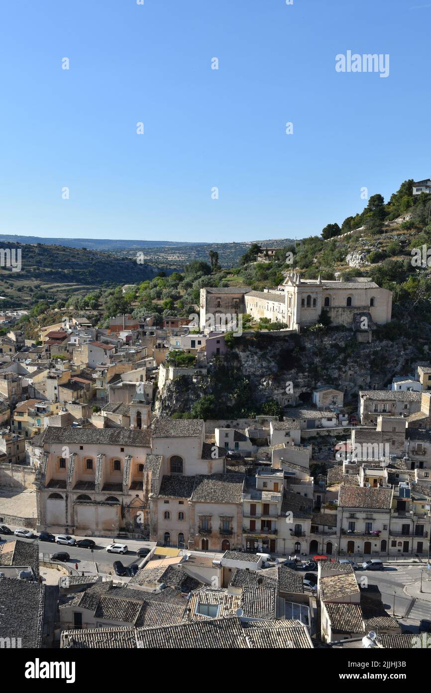 A vertical shot of the beautiful white residential buildings in Sicily ...