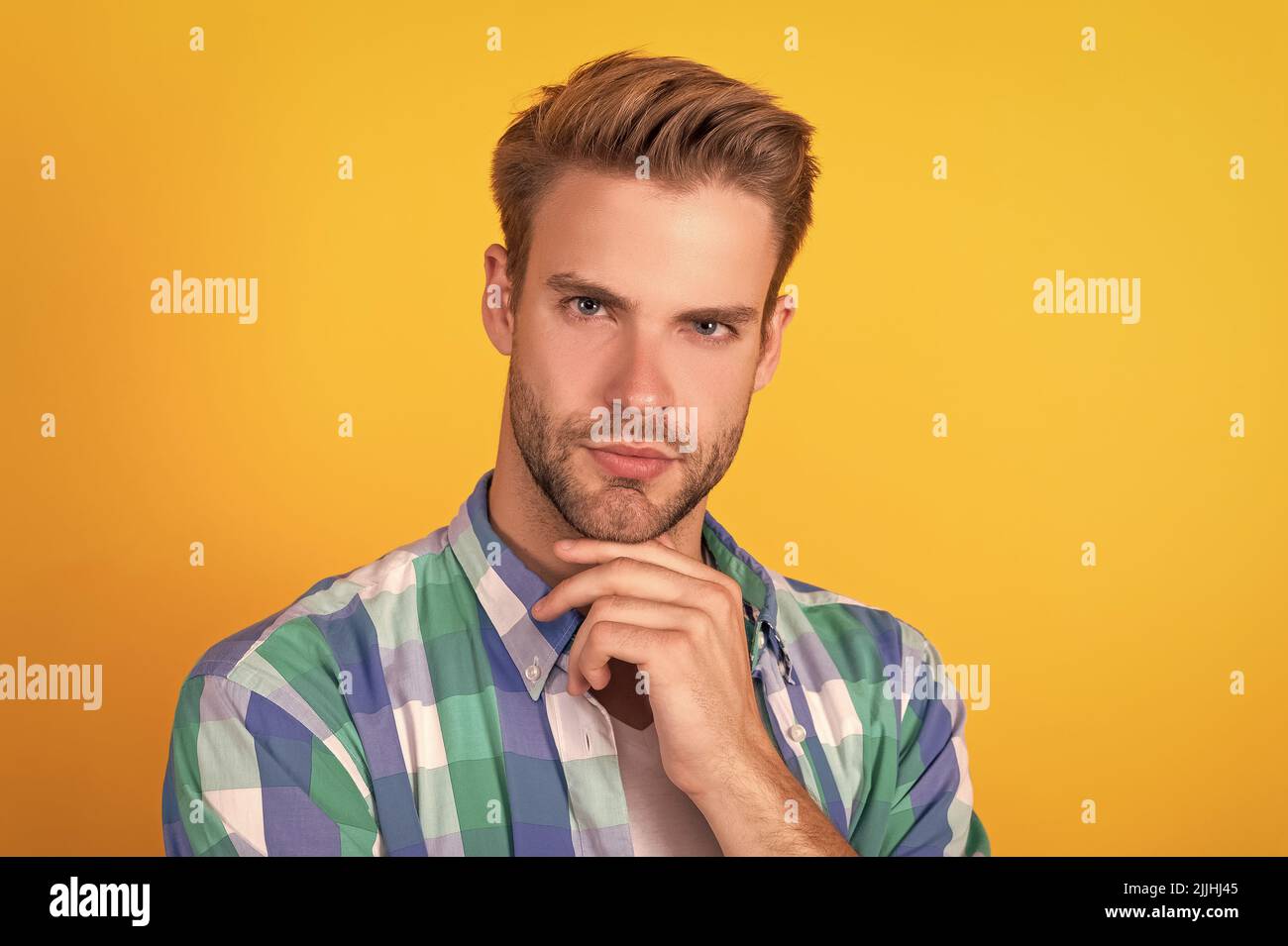 Portrait of serious handsome guy think with thoughtful face yellow ...
