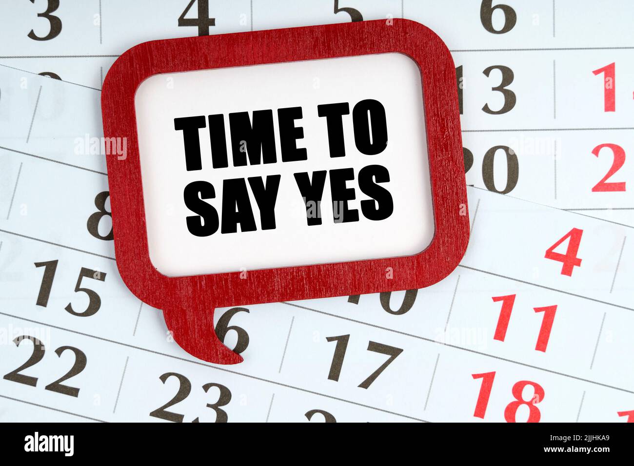 Business concept. On the calendar, a red plaque with the words inside ...