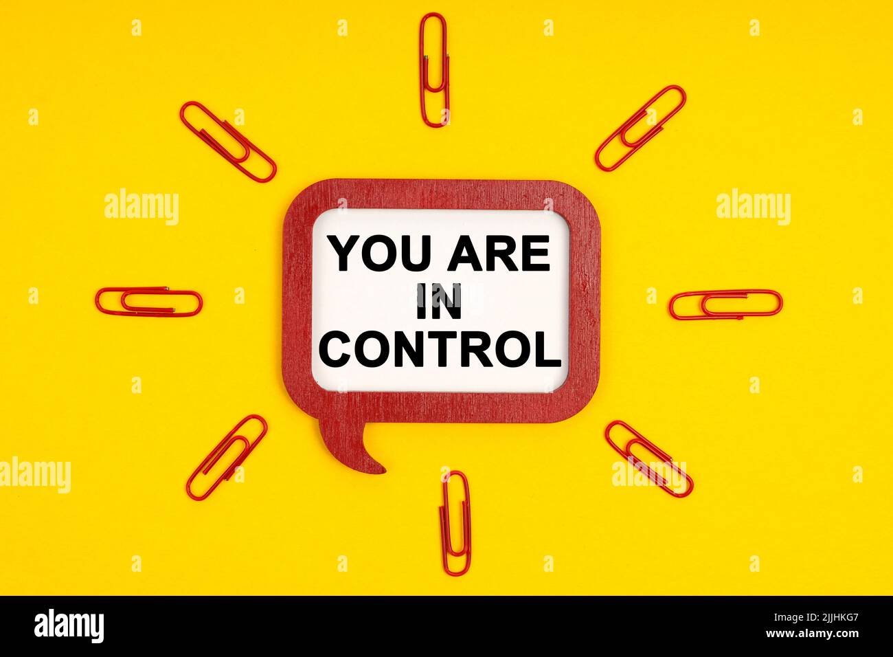 Business and education concept. On a yellow background, paper clips and ...