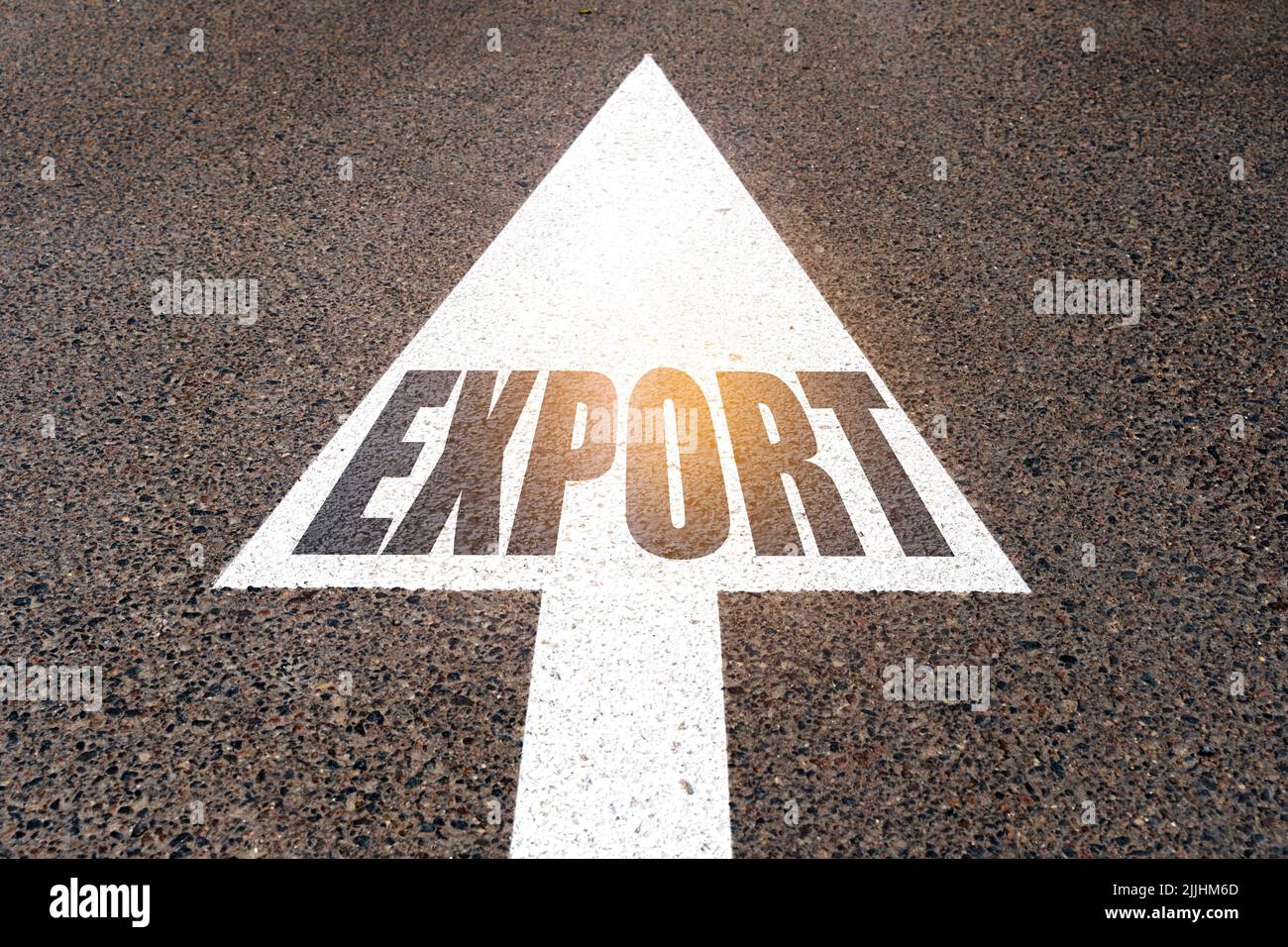 Business concept. On the asphalt road markings an arrow with the ...