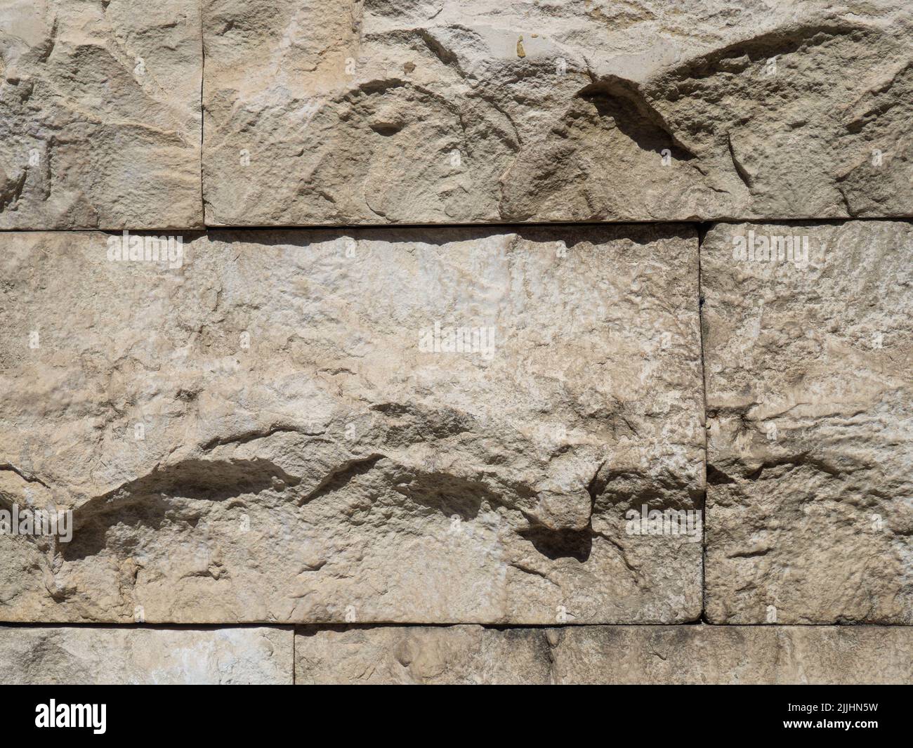 Uneven, bulky tiles. Stone background. Masonry. Pattern Stock Photo - Alamy