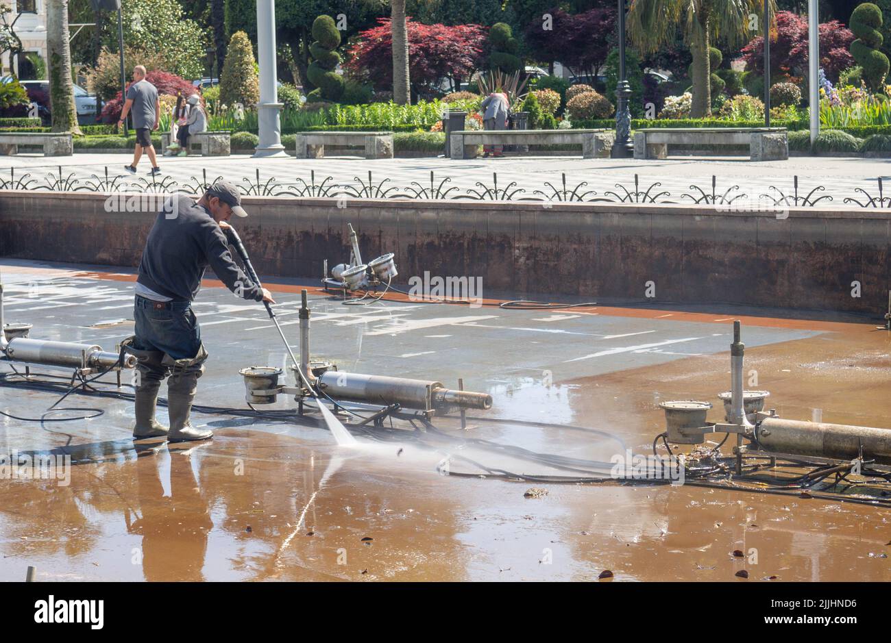 Batumi, Georgia. 05.23.2022 The worker cleans the mechanism of the ...
