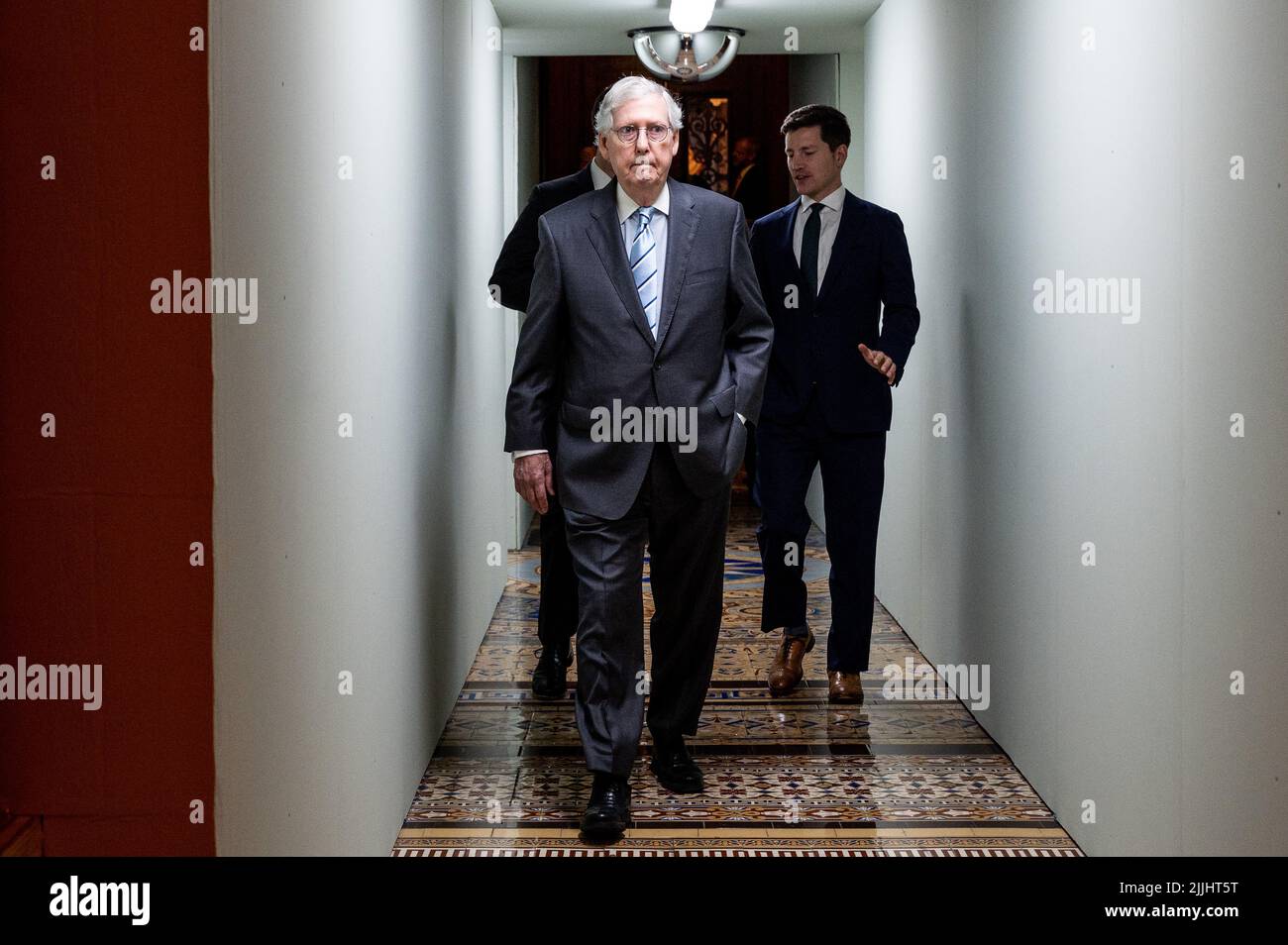Senate Minority Leader Mitch McConnell (R-KY) walking through a ...