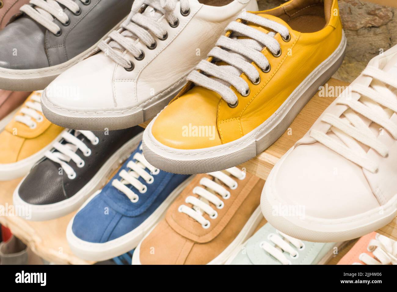 Colorful shoes in a retail shop Stock Photo - Alamy