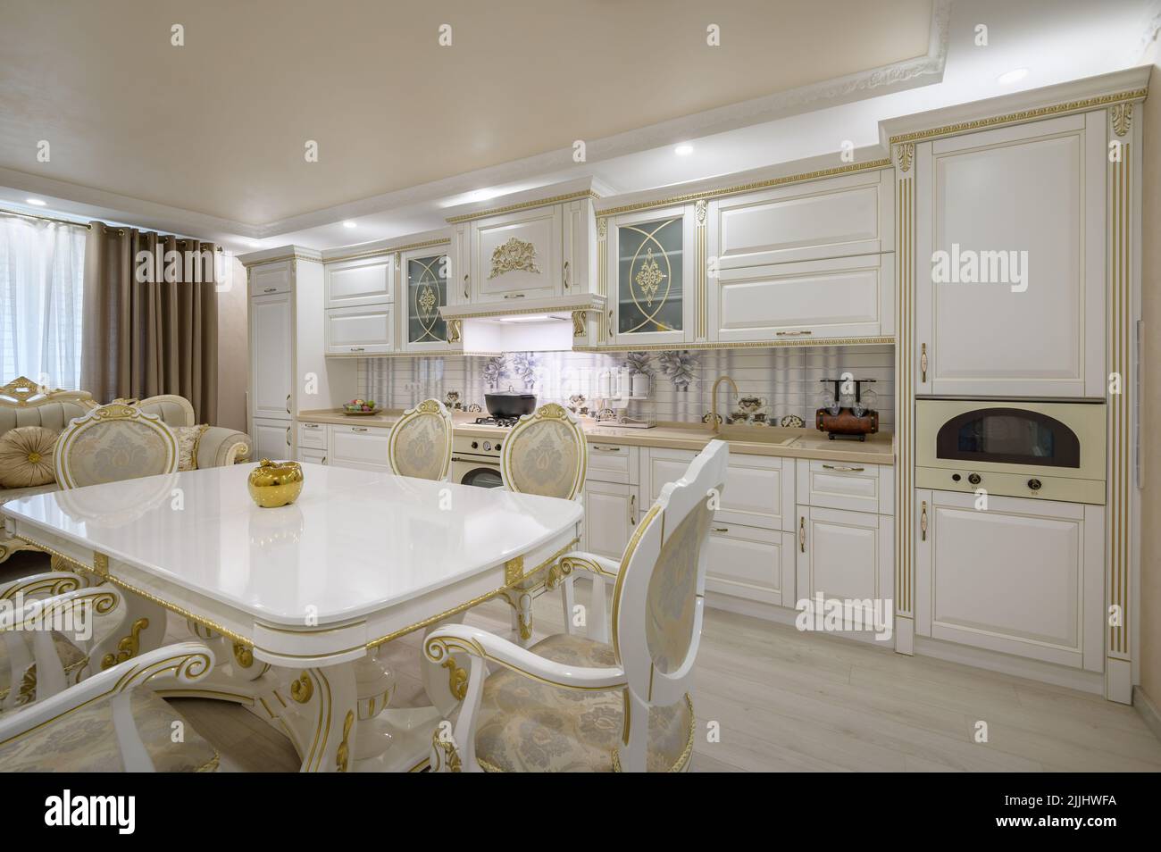 Renovated Interior of rich classic white kitchen Stock Photo - Alamy