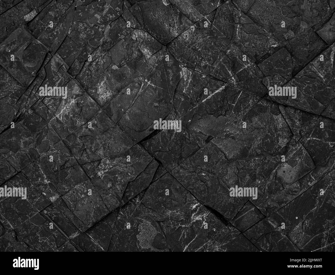 A black and white image of shale sedimentary stone alongside the St ...