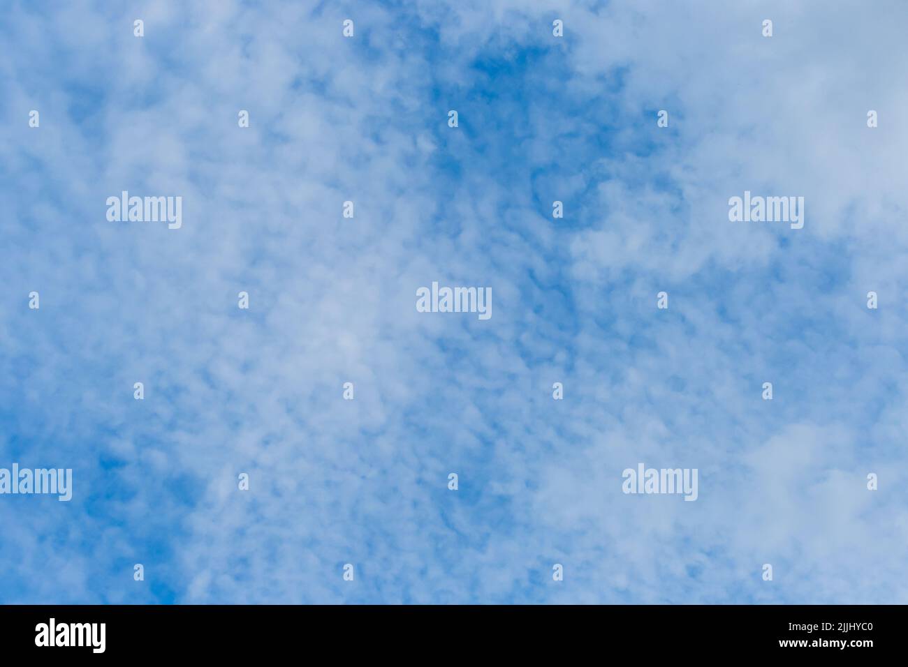 White solid clouds soft blue sky background nature day weather air Stock Photo - Alamy