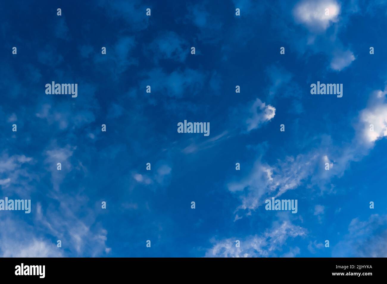 White clouds mild windy weather nature background sky Stock Photo - Alamy