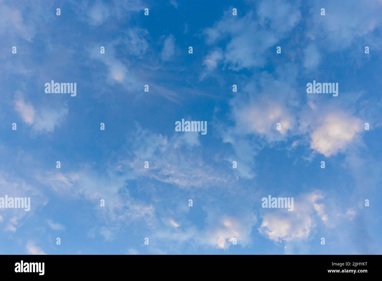 White clouds mild windy weather nature background sky Stock Photo - Alamy