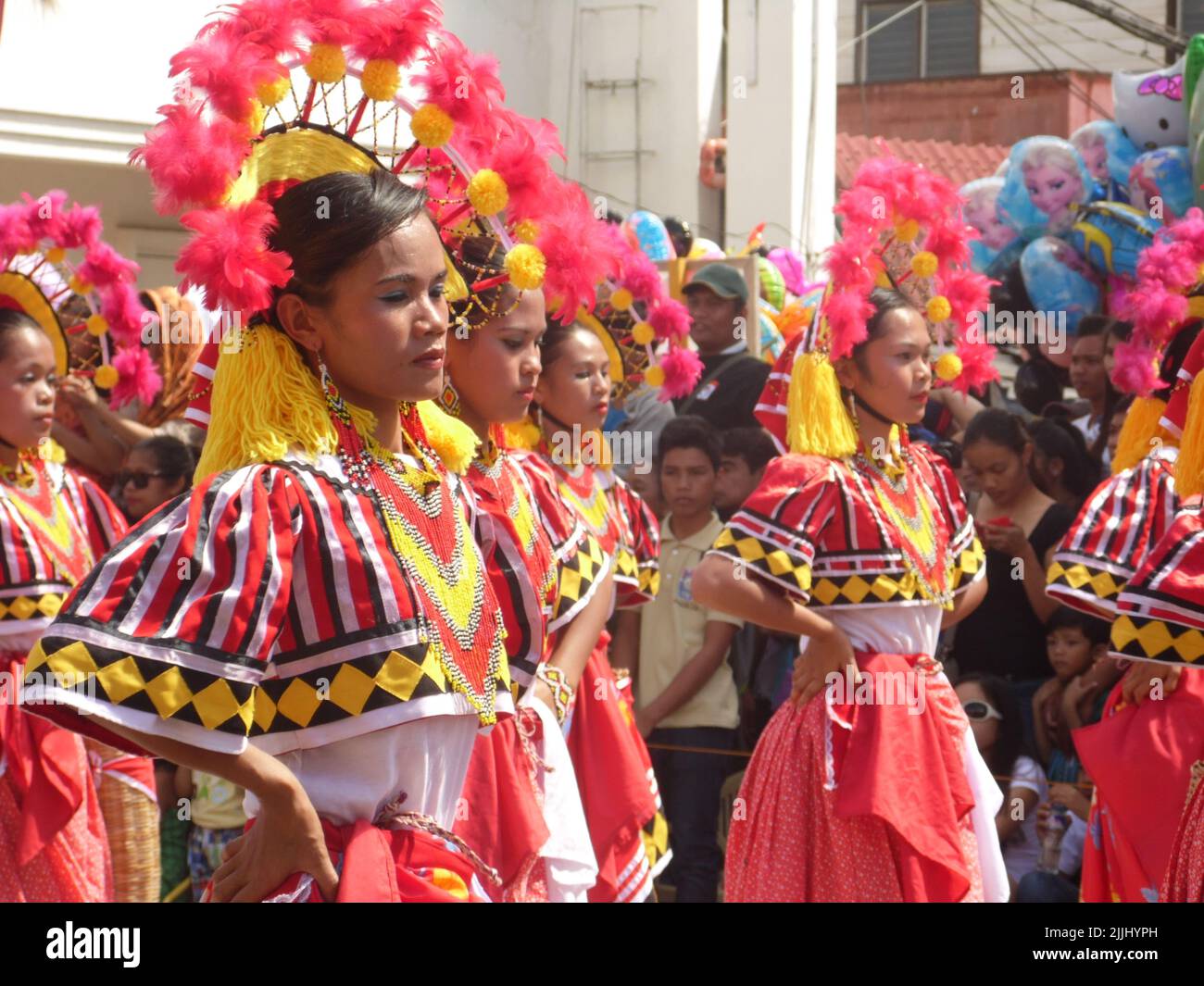 A group of people in cultural costumes dancing in a parade Stock Photo ...