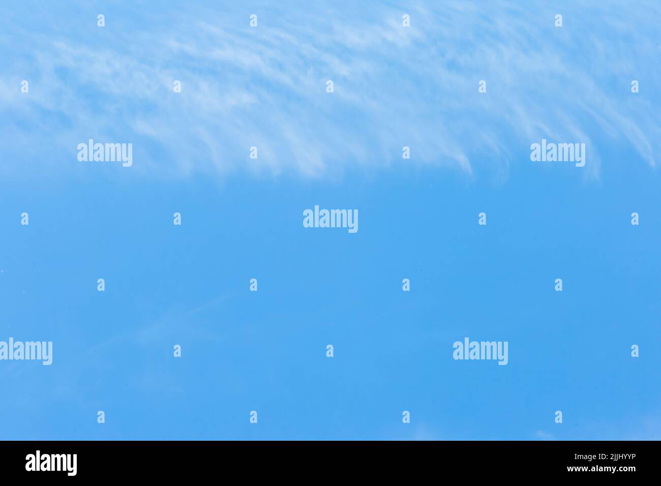 Clear blank blue sky with small translucent white clouds natural ...