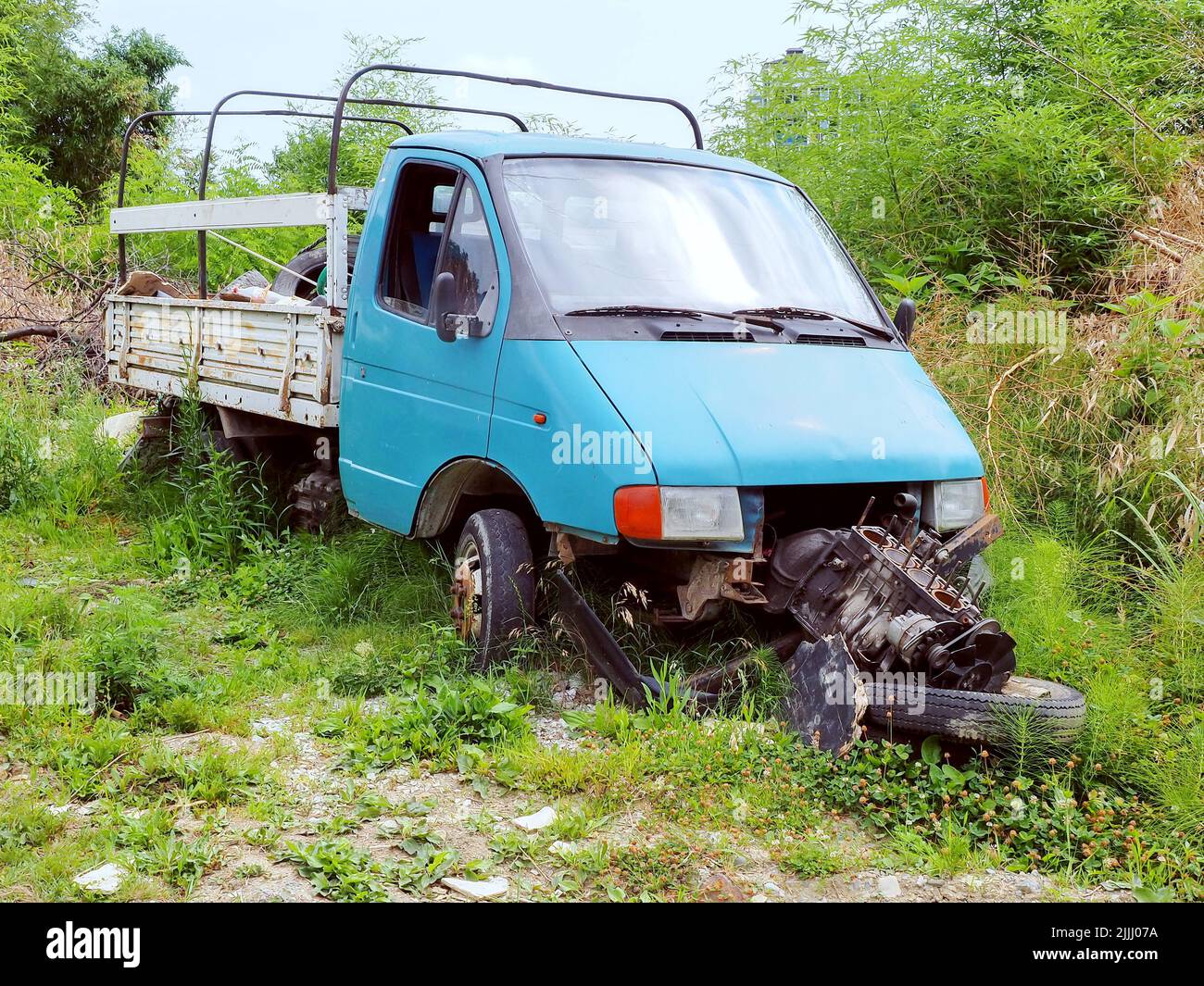 Car dismantled for parts. A broken old truck with dropped engine. Parts ...