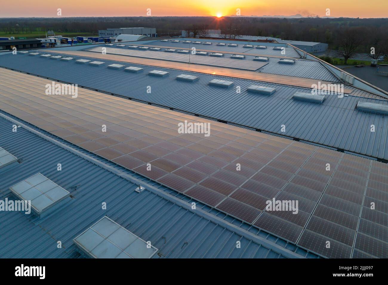 Aerial view of blue photovoltaic solar panels mounted on industrial ...