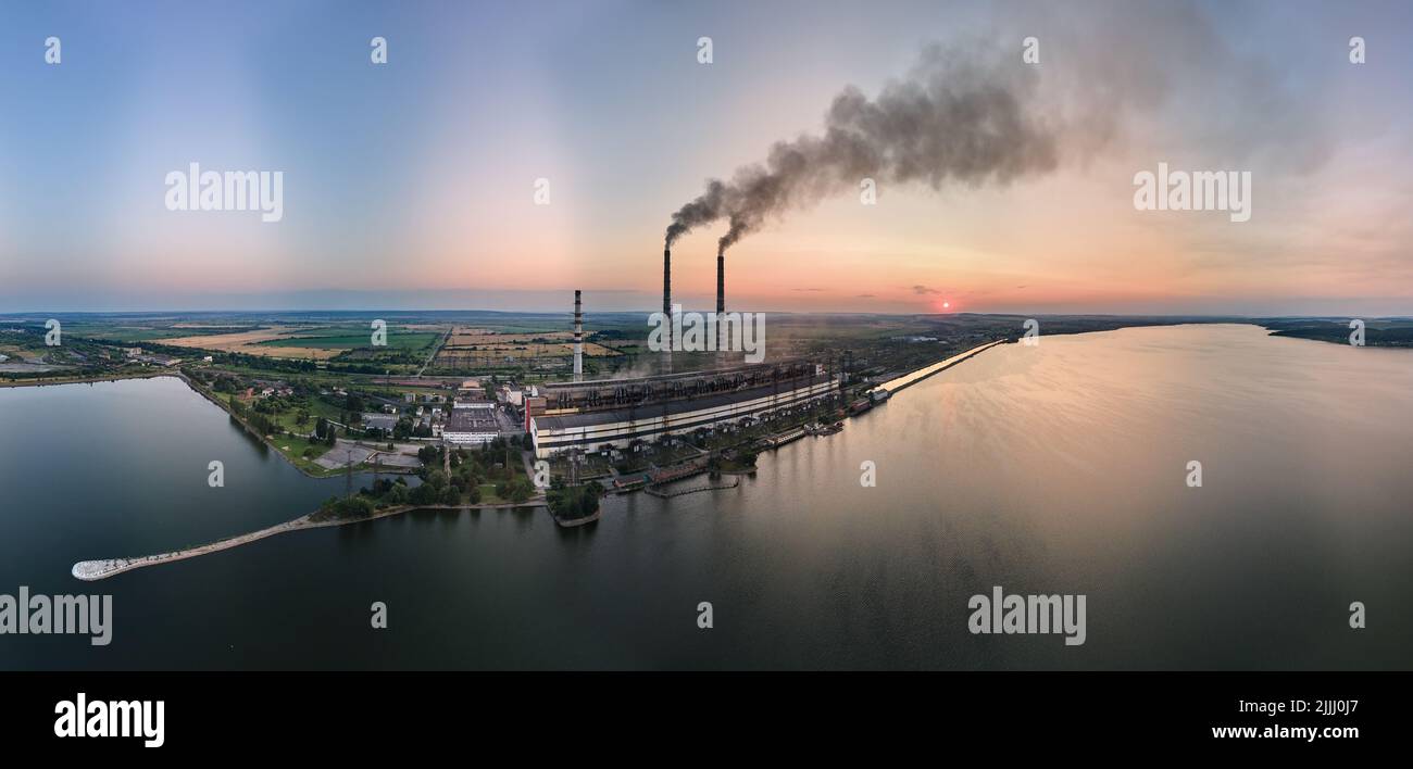 Aerial view of coal power plant high pipes with black smokestack ...