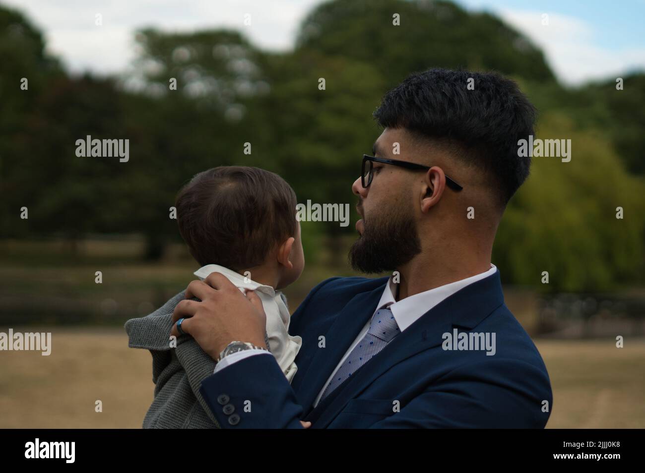 Asian Pakistani Father is holding his 11 Months Old Infant at Local ...