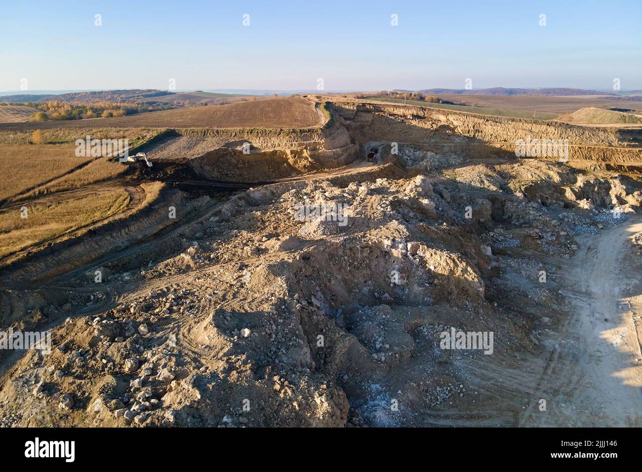 Sandstone and excavator in stone quarry hi-res stock photography and ...