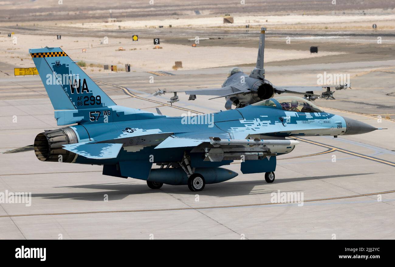 Two F-16 Aggressors assigned to the 64th Aggressor Squadron, Nellis Air Force Base, Nevada ...