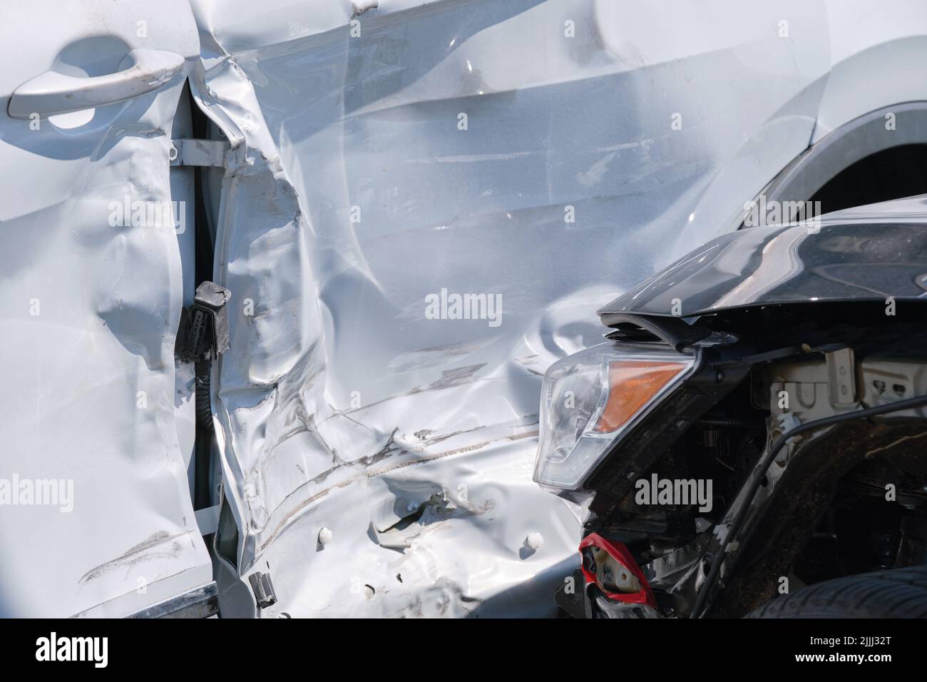 Damaged in heavy car accident vehicles after collision on city street ...