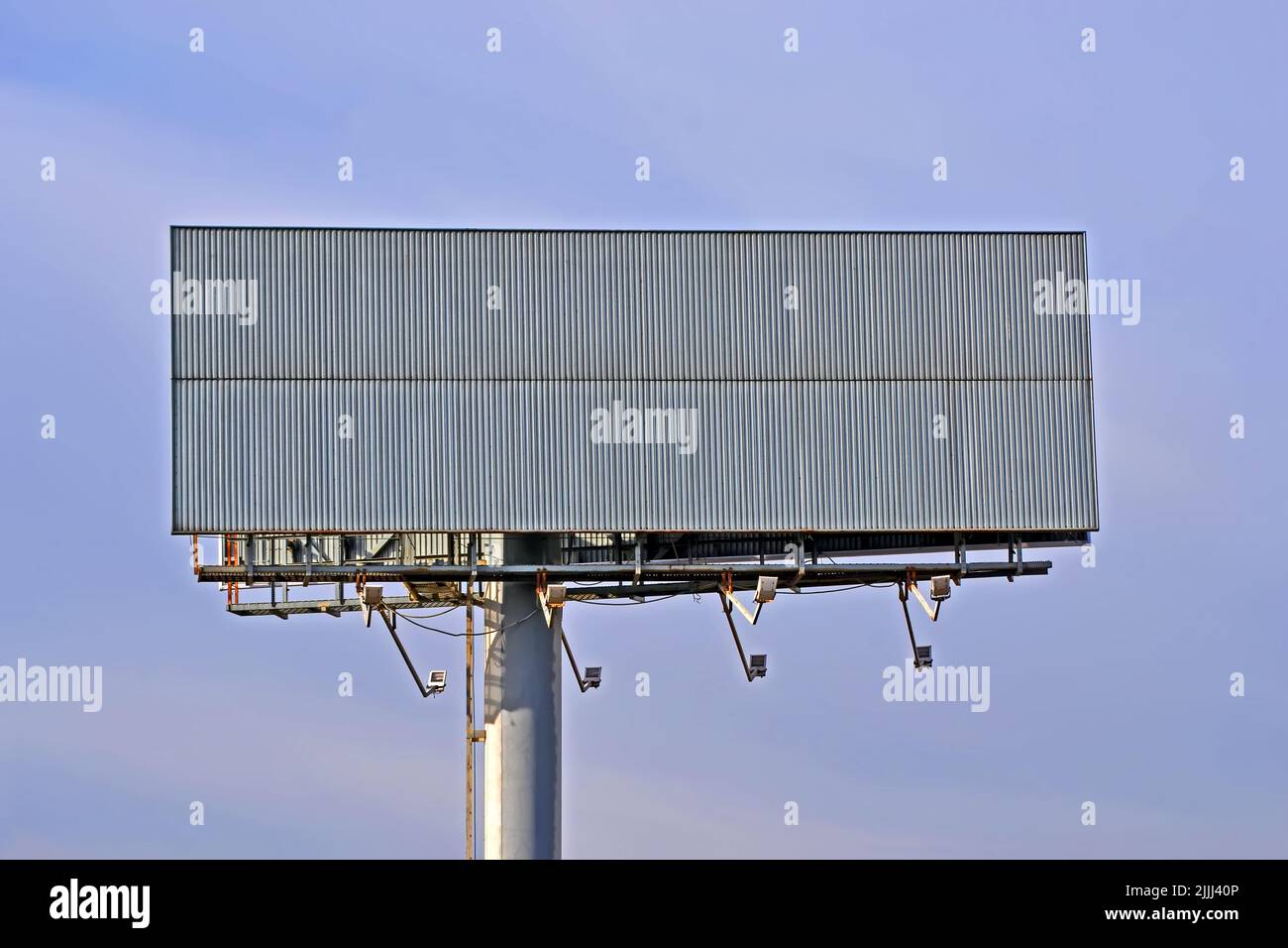 huge empty wide big board on pylon on blue sky, crisis advertising ...