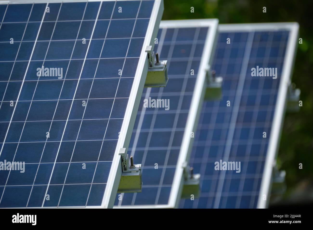 Solar photovoltaic panels mounted on stand-alone frame on backyard ...