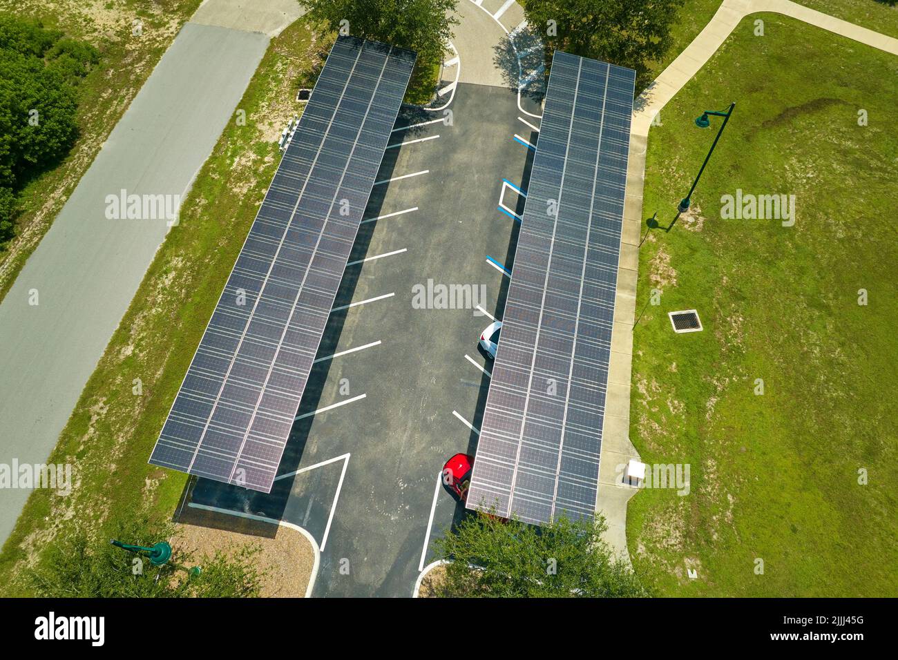 Solar panels installed over parking lot for parked cars for effective ...
