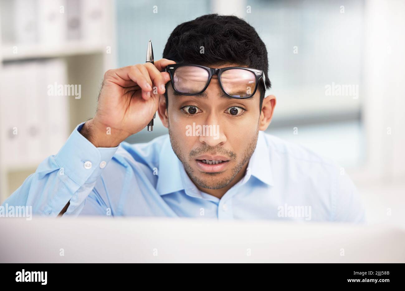 This absolutely cannot be happening. a young businessman looking ...