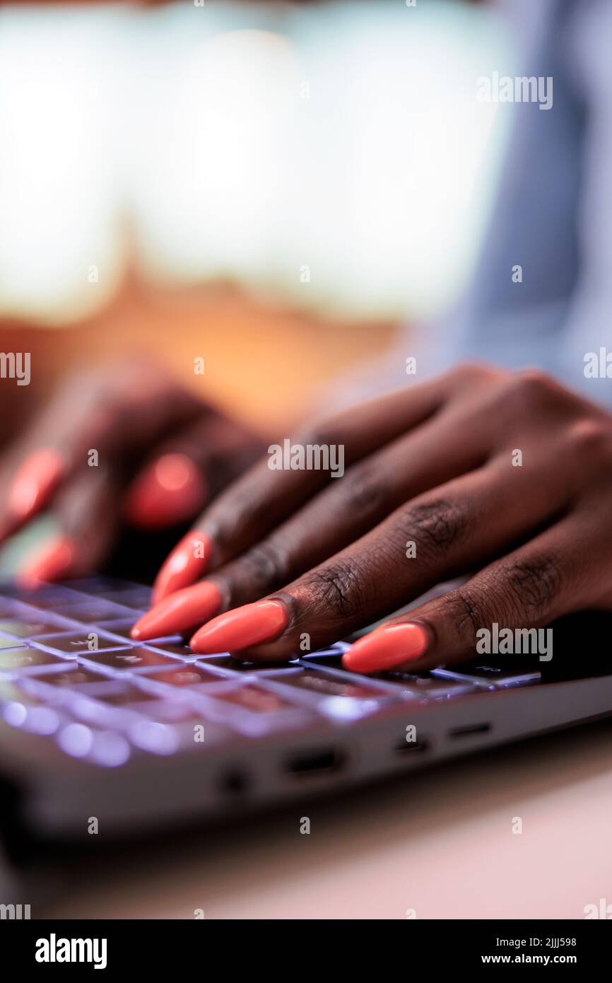 African american company remote worker typing message on laptop ...