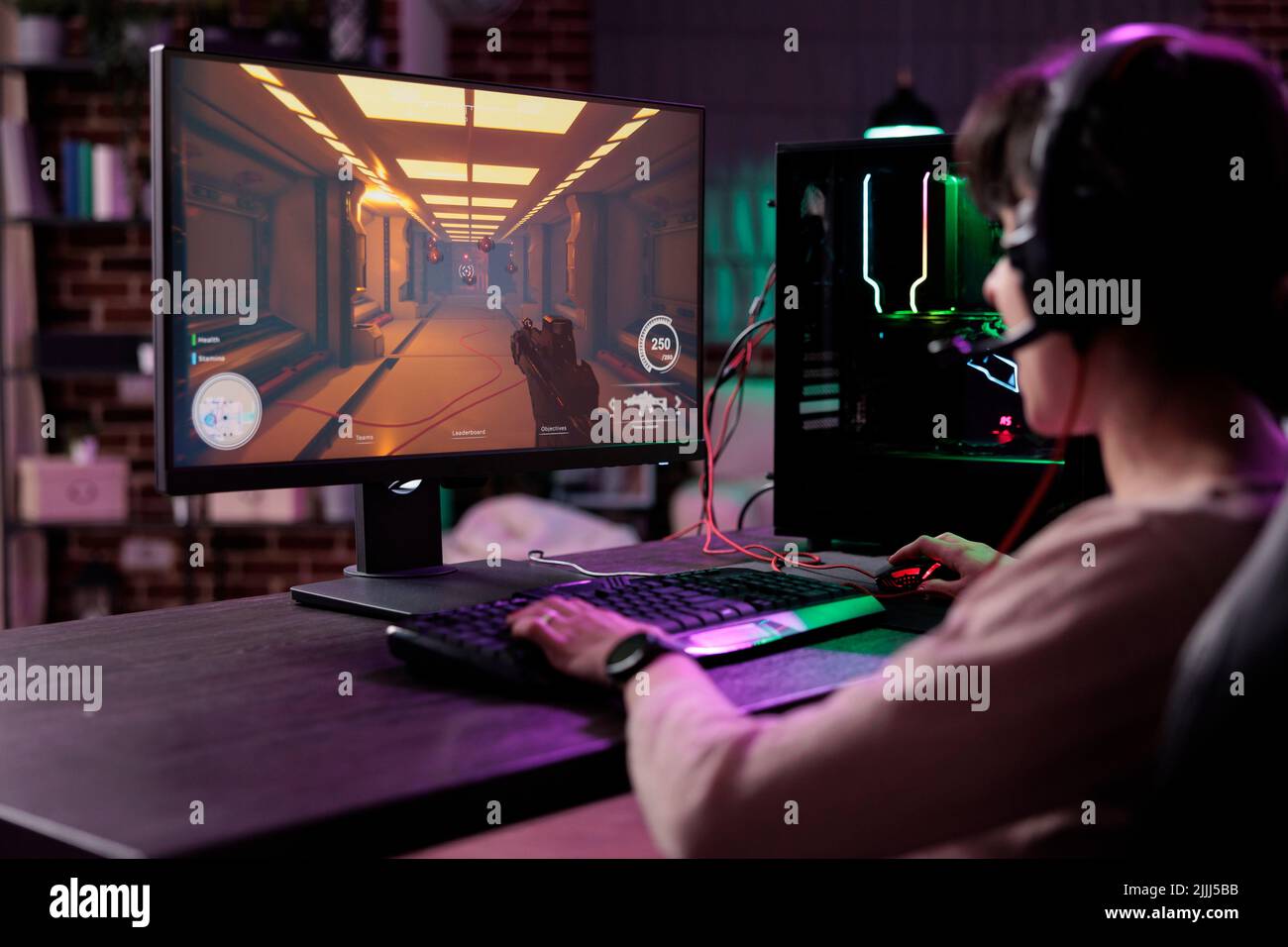 Young gamer having fun with action video games competition, playing ...