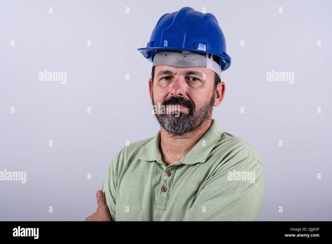 Portrait of 60 years old professional heavy industry engineer/worker ...