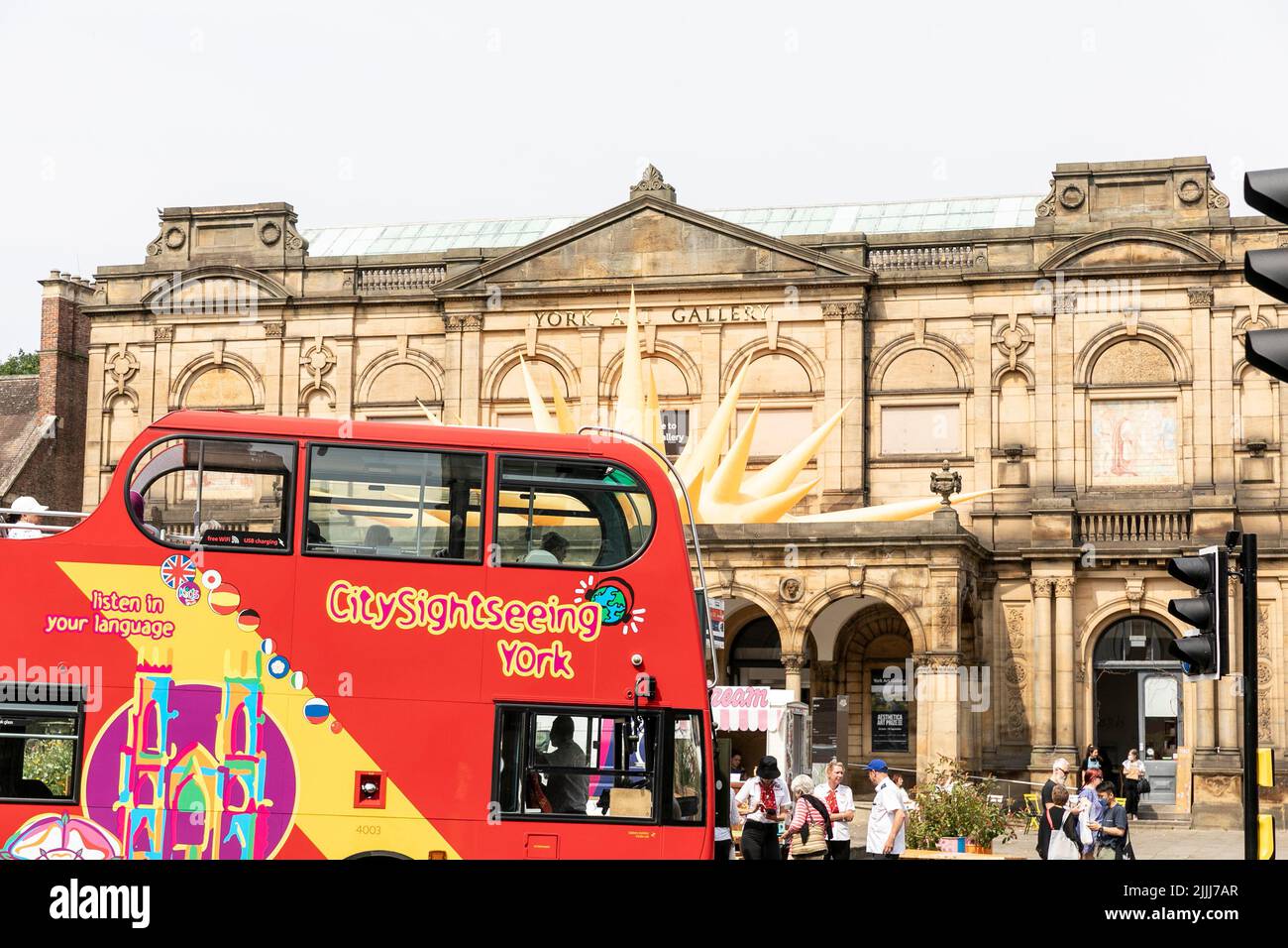 York city centre England, red double decker sightseeing bus providing ...