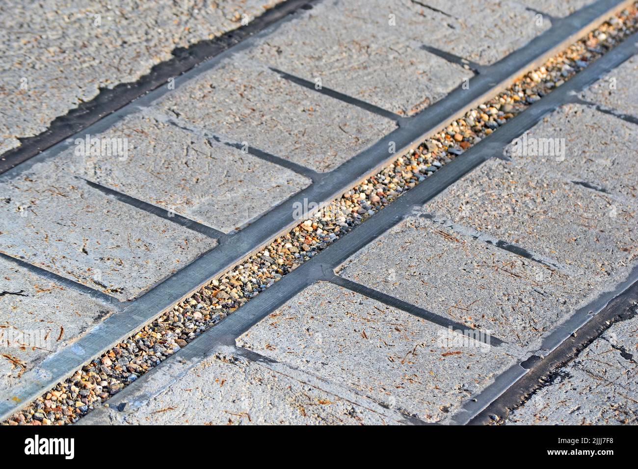 abstract metal line barrier on stone surface closeup, modern technology ...