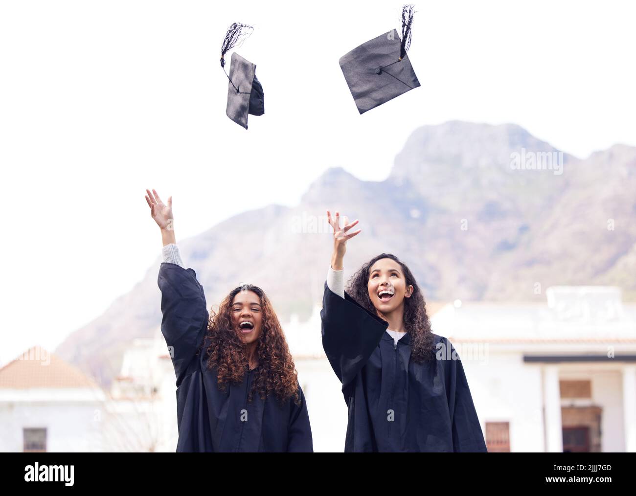 Graduation is better when we do it together. two young women throwing ...
