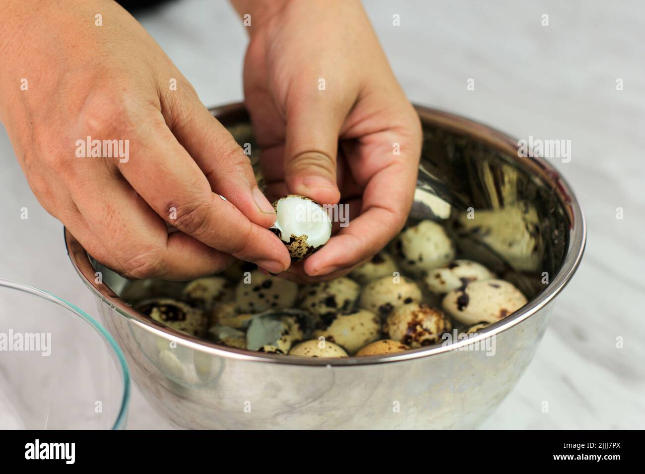 Asian Old Woman Hand Peel Quail Egg on Stainless Bowl. Cooking process ...