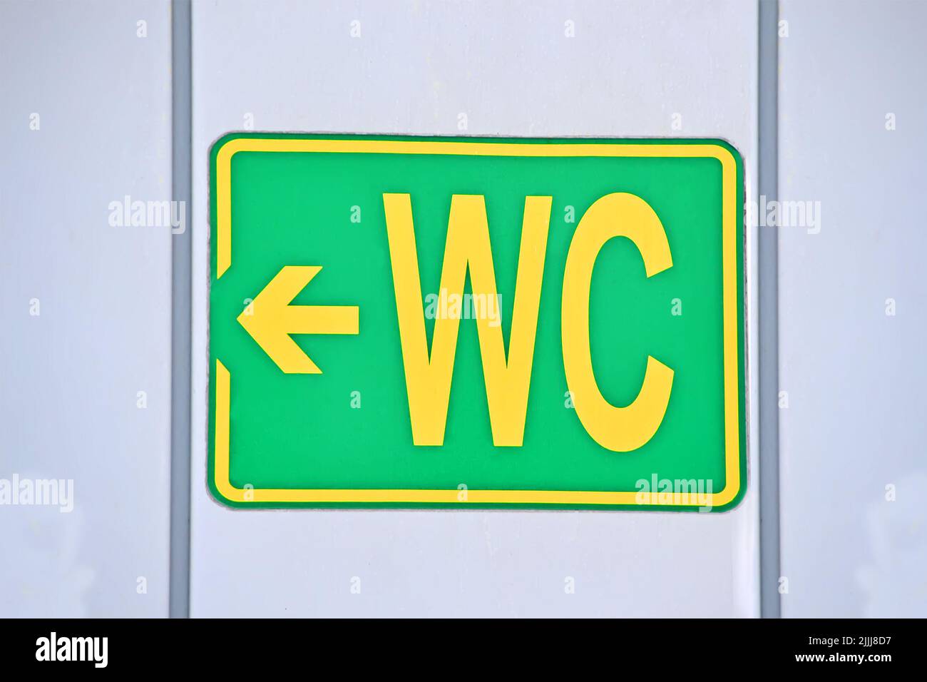 toilet green sign on the wall, environment diversity Stock Photo - Alamy