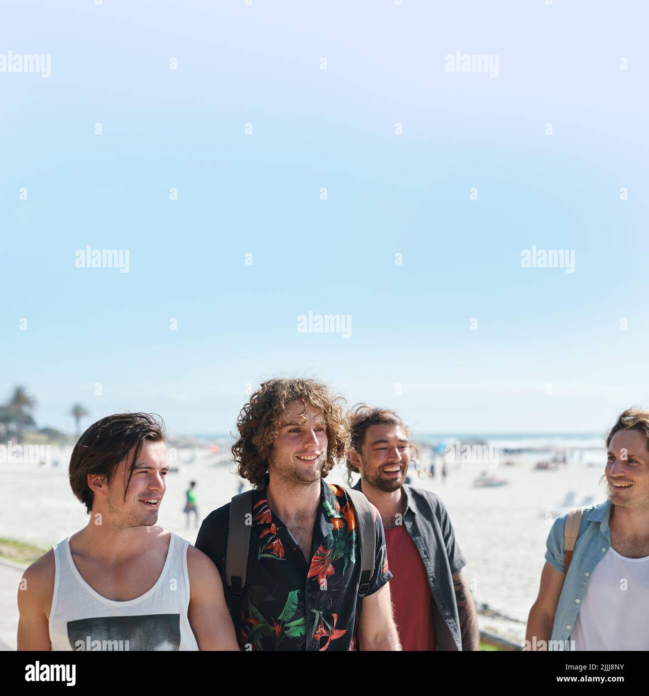 group of male friends on beach enjoying summer holiday students having ...