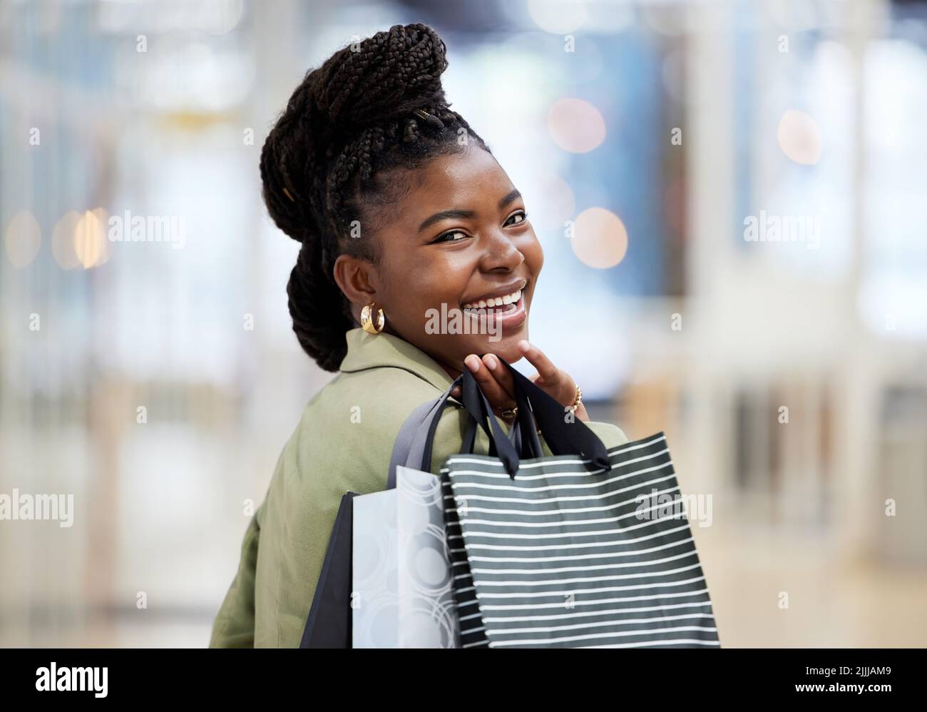 Doing some real retail damage. a young woman enjoying a day of shopping ...